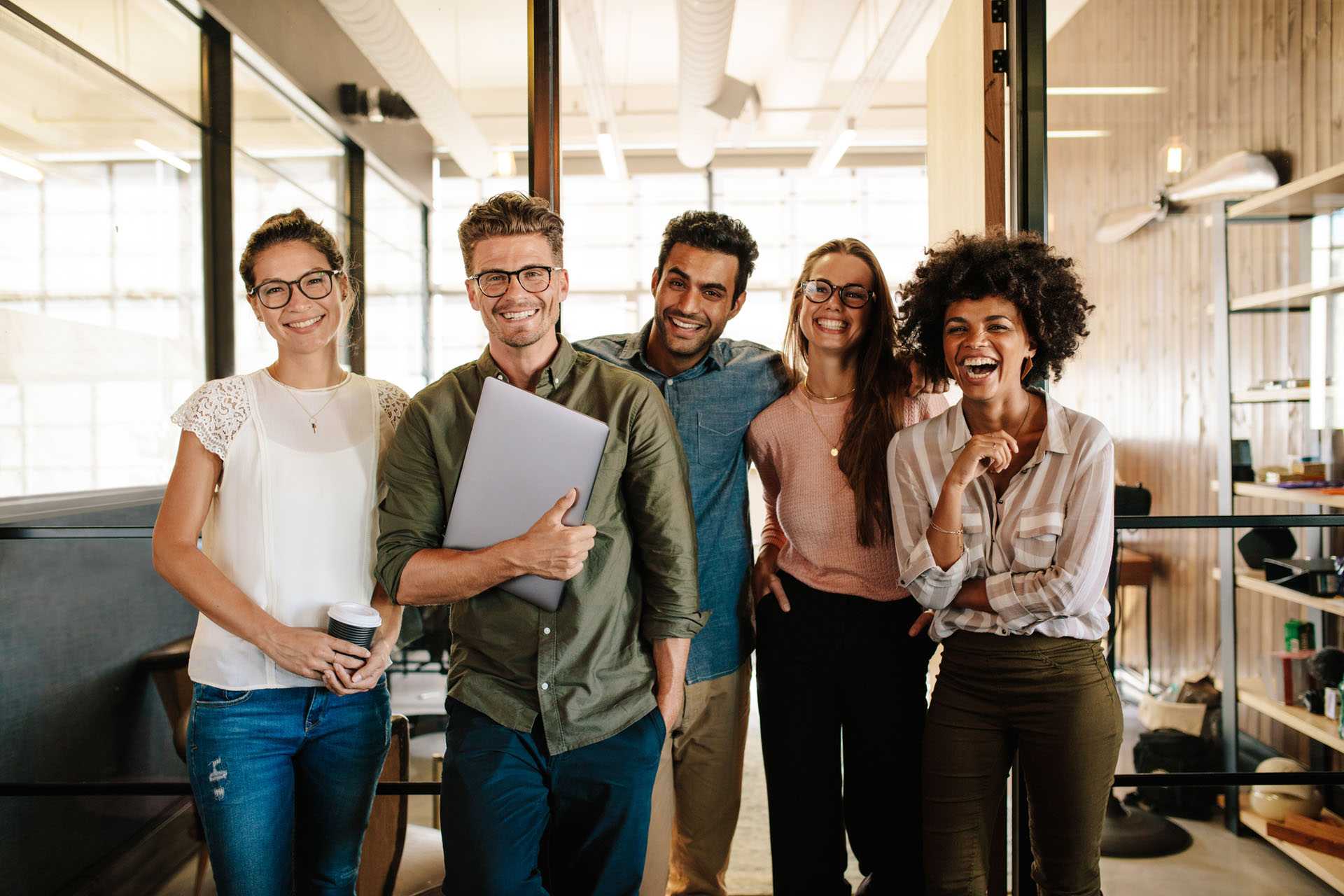 Creative business team laughing together – Aspire Worldwide Creative business team laughing together – Aspire Worldwide